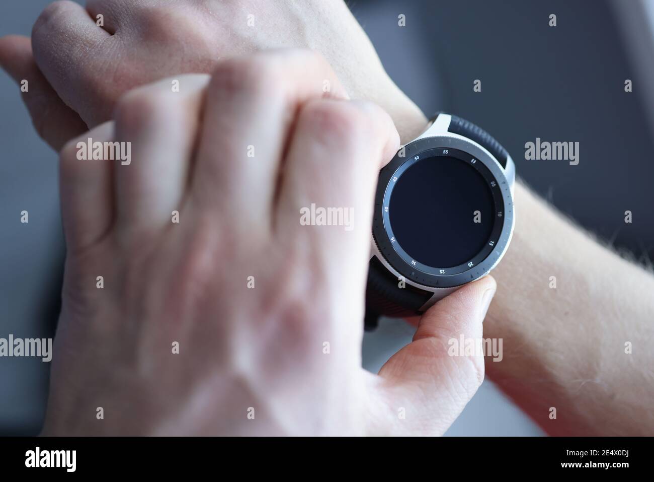 Man's hand is wearing black smart watch Stock Photo - Alamy