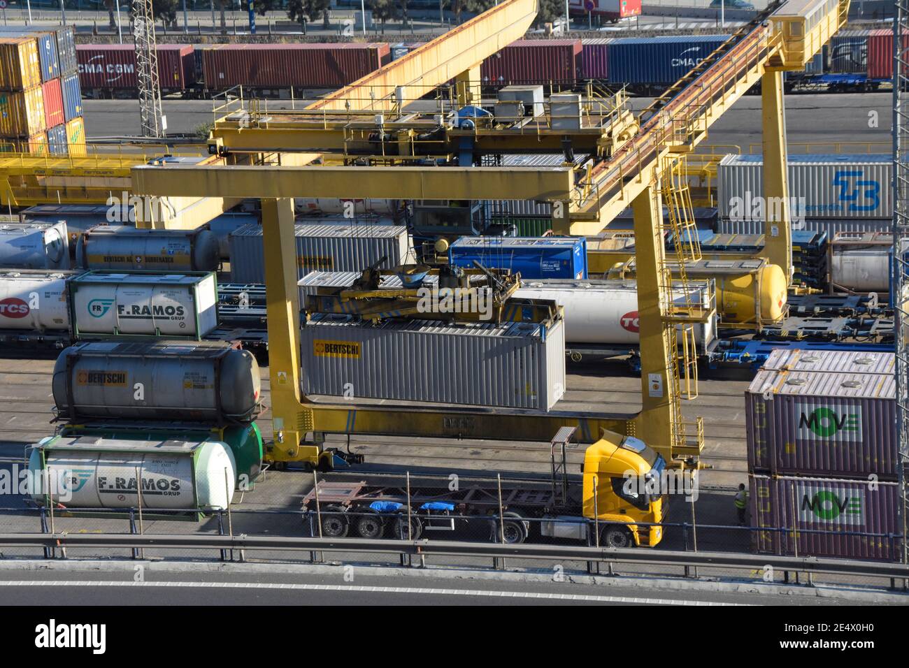 View of a large crane loading a container onto a truck at the Barcelona ...