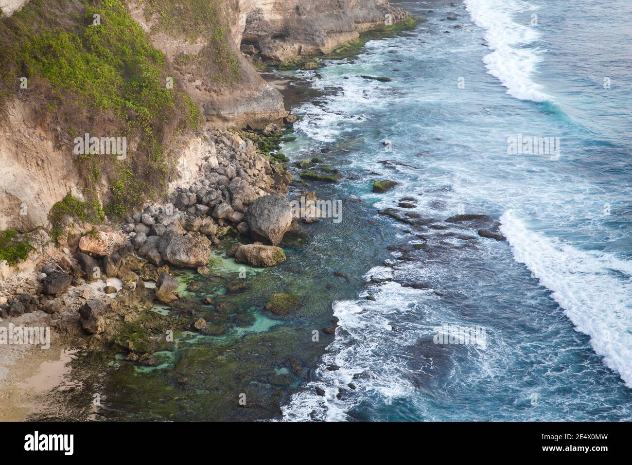 View of Uluwatu cliff with pavilion and blue sea in Bali, Indonesia ...
