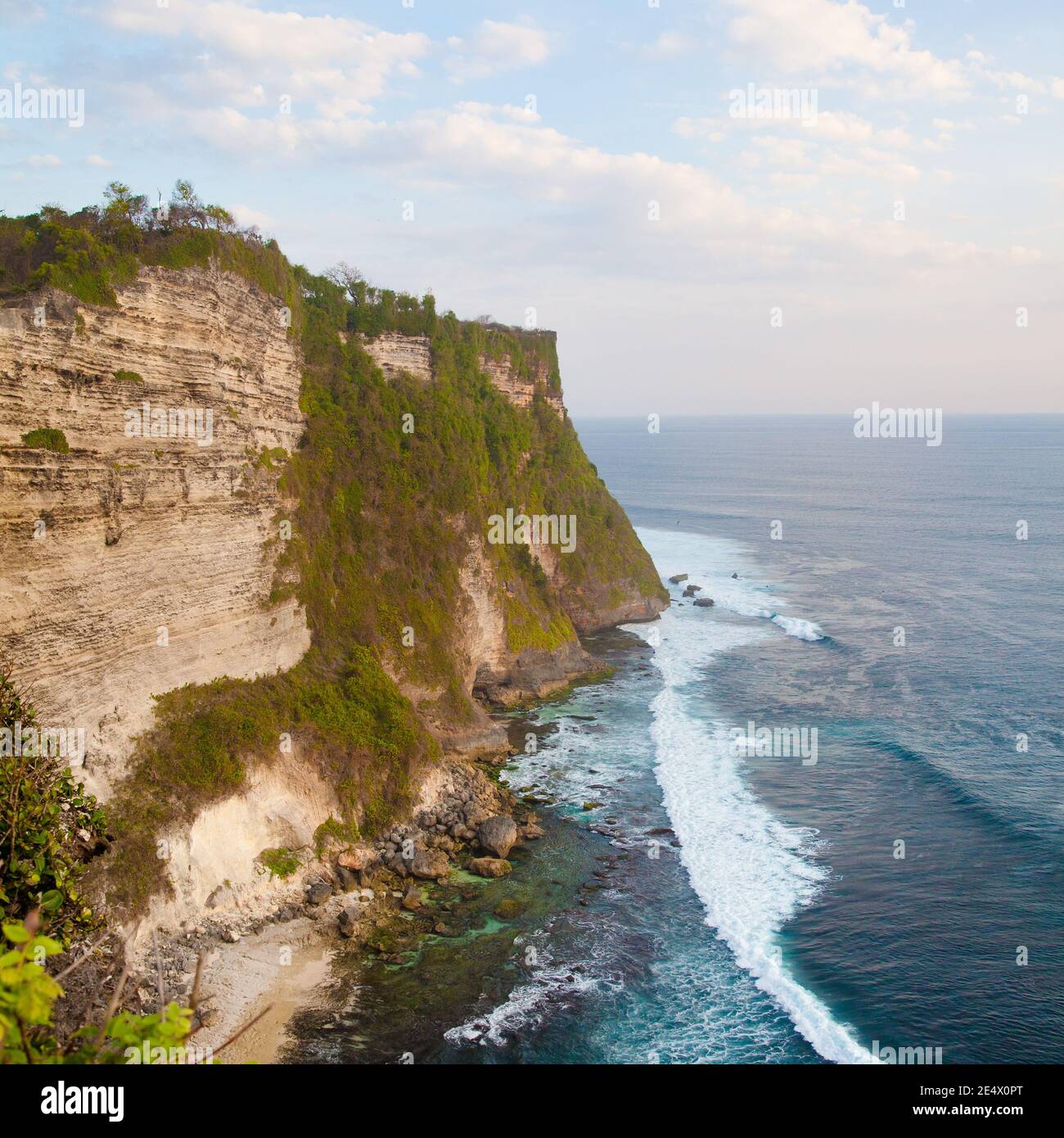 View of Uluwatu cliff with blue sea in Bali, Indonesia. Rocky cliff and ...