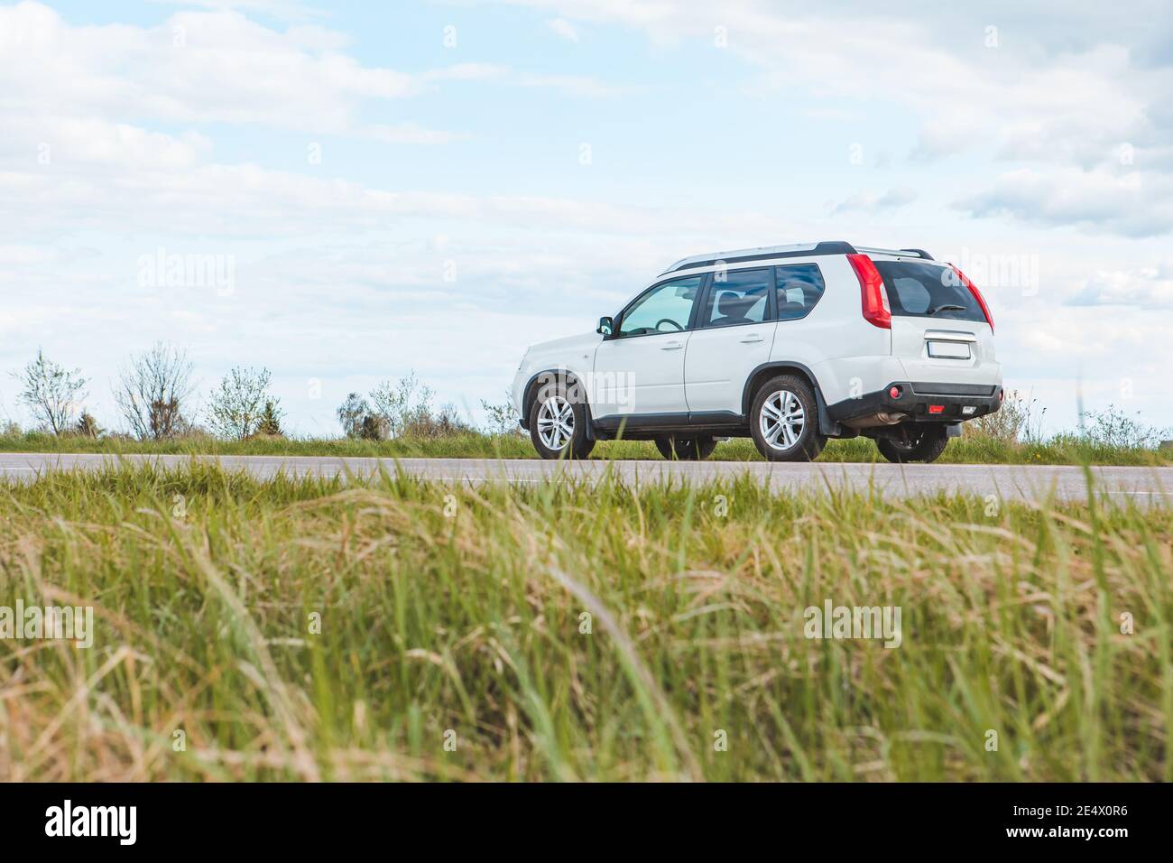 white suv car at roadside. road trip concept. car travel. copy space ...