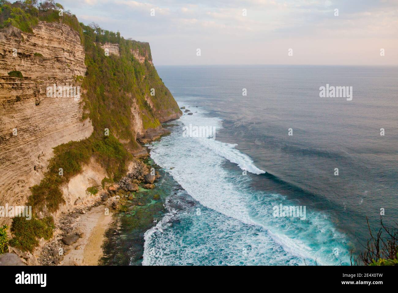 View of Uluwatu cliff with pavilion and blue sea in Bali, Indonesia ...