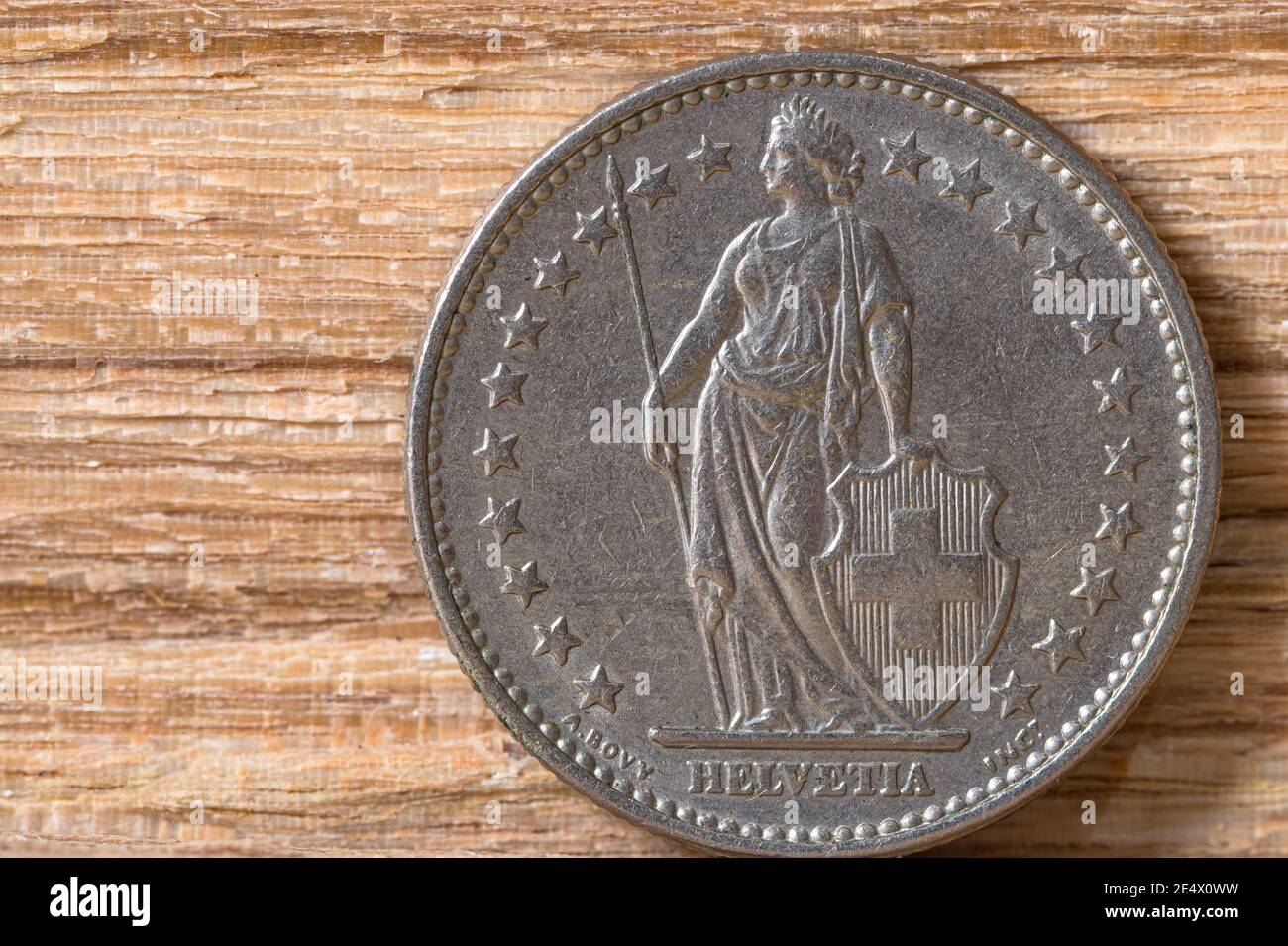 Old rusty Swiss coin on a wooden surface Stock Photo - Alamy