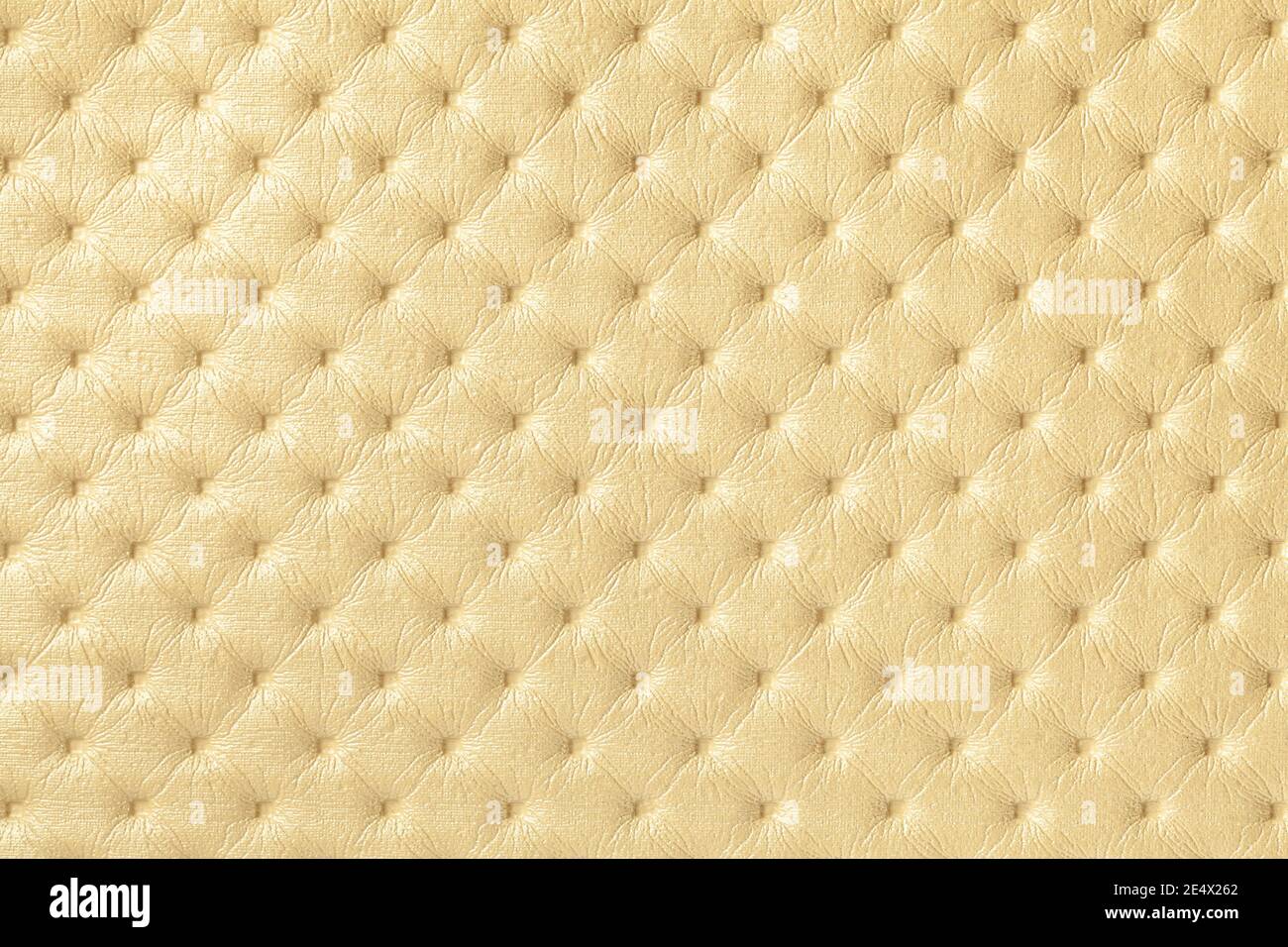 Texture of light yellow leather background with capitone pattern, macro ...