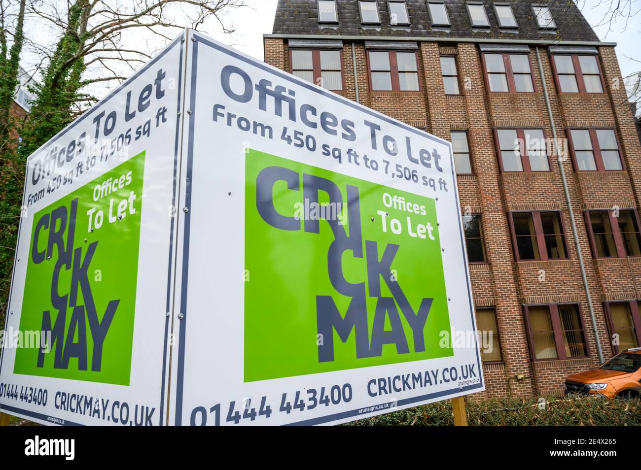 Estate agent's board with "Offices to let" outside office block in ...