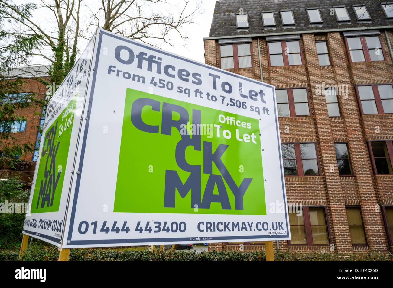 Estate agent's board with "Offices to let" outside office block in ...
