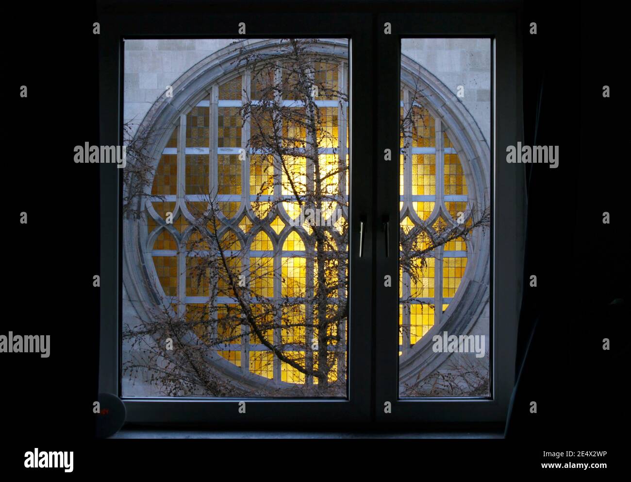 View of a round church window framed by a square window Stock Photo - Alamy