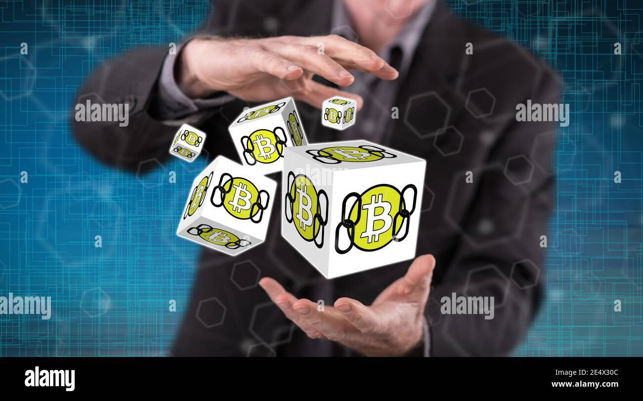 Bitcoin concept between hands of a man in background Stock Photo - Alamy