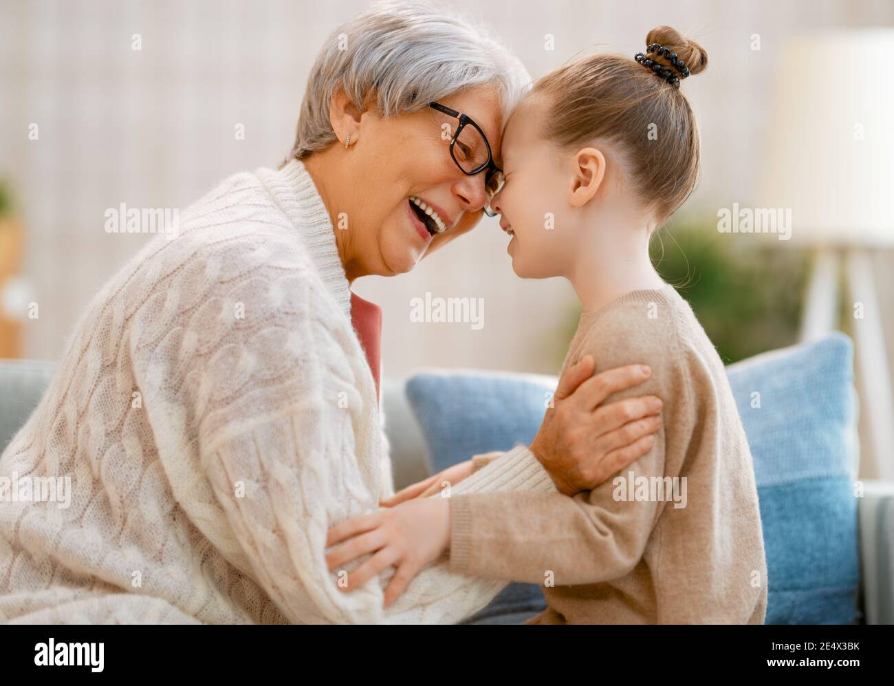 A nice girl and her grandmother enjoying sunny morning. Good time at ...