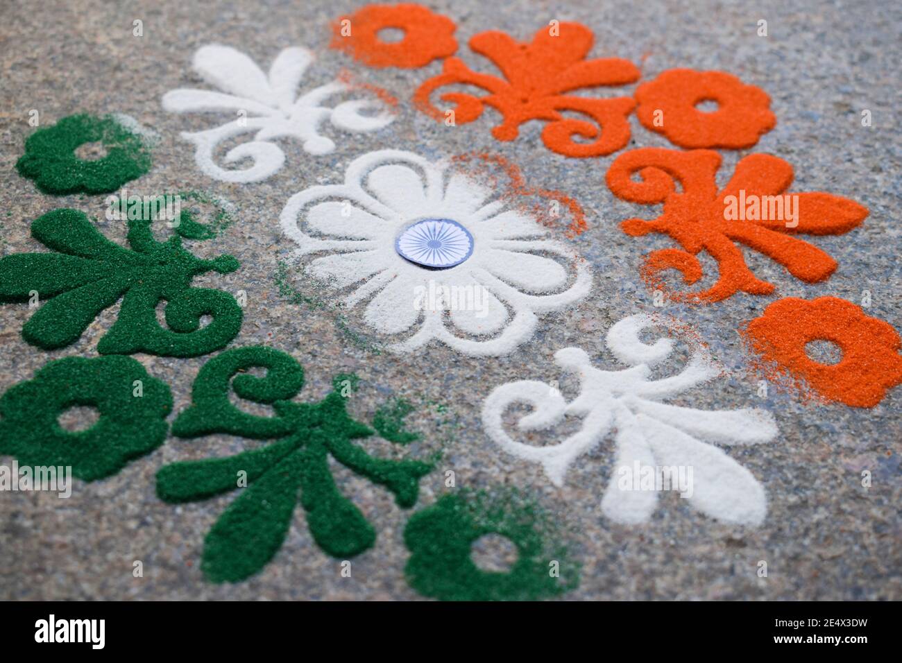 Tri color rangoli of Flower motif design drawn and coloured on the ...