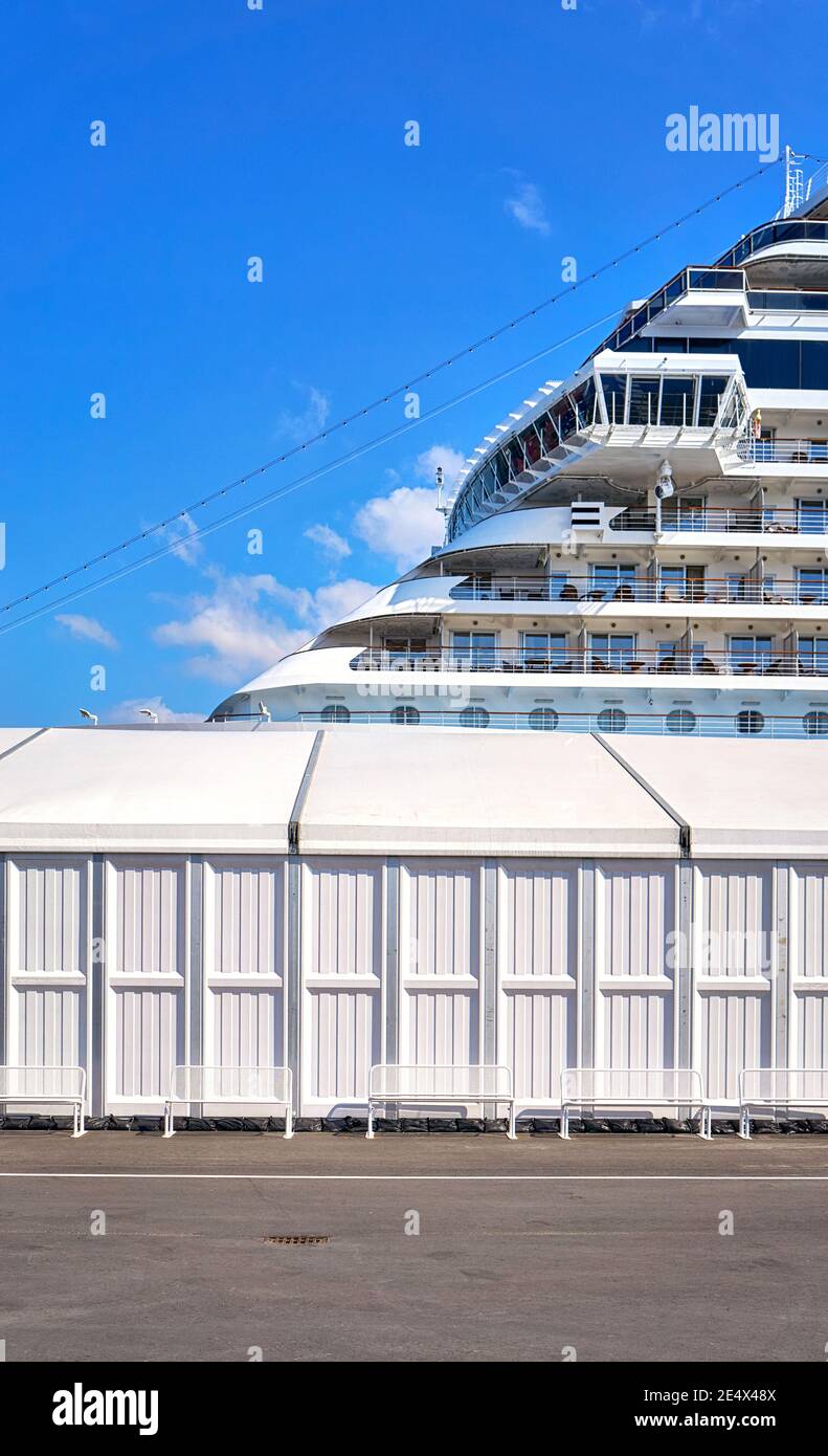 Cruise ship deck behind a white check-in hall Stock Photo - Alamy