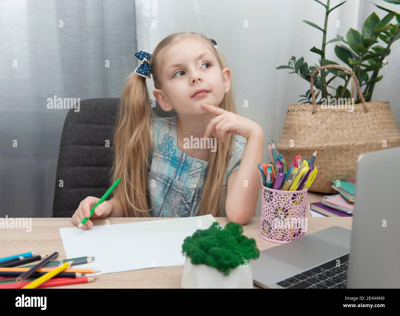 Cute girl doing homework in her room at home Stock Photo - Alamy