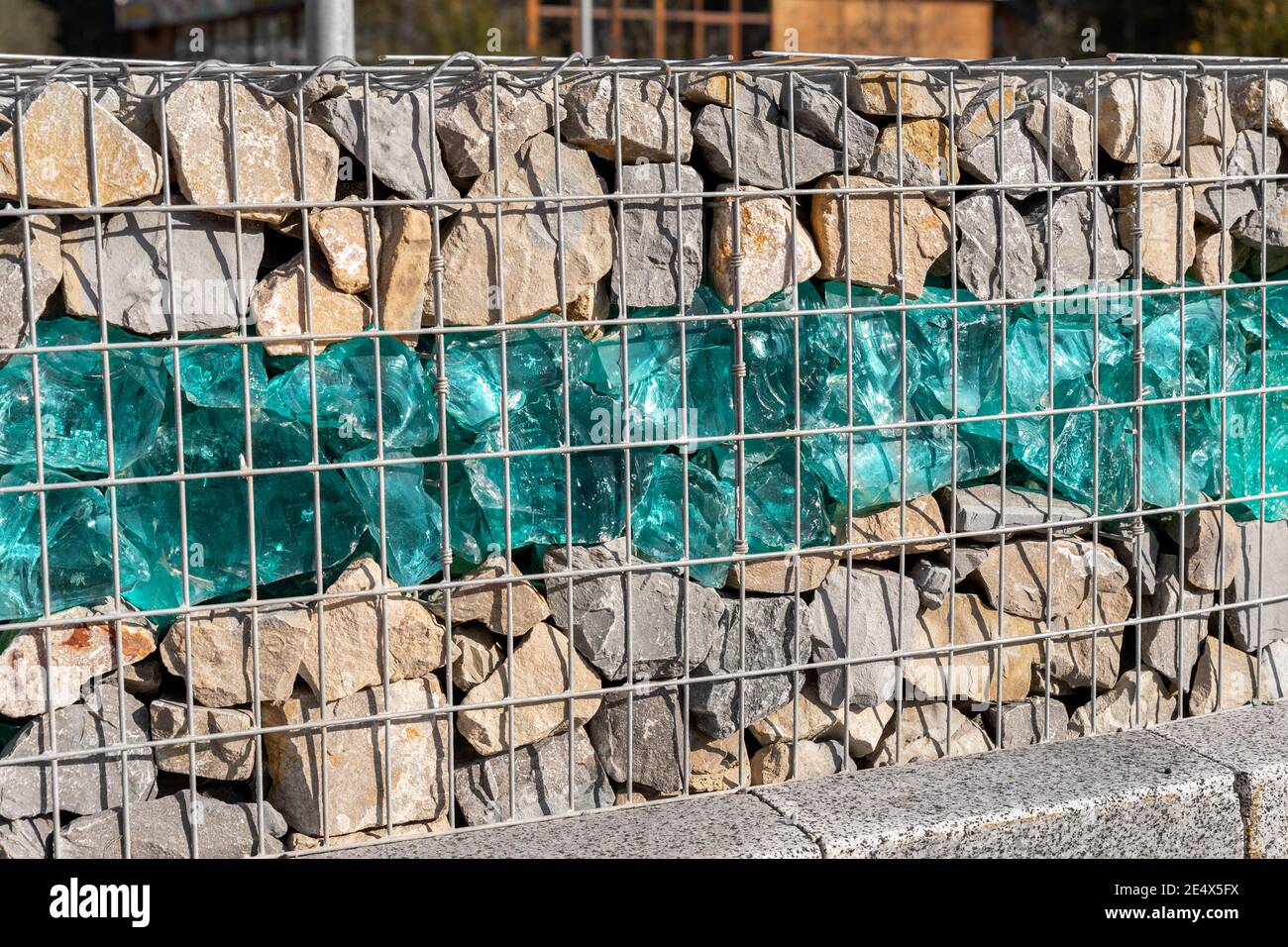 Close-up detail of new modern beautiful gabion fence with metal cage ...