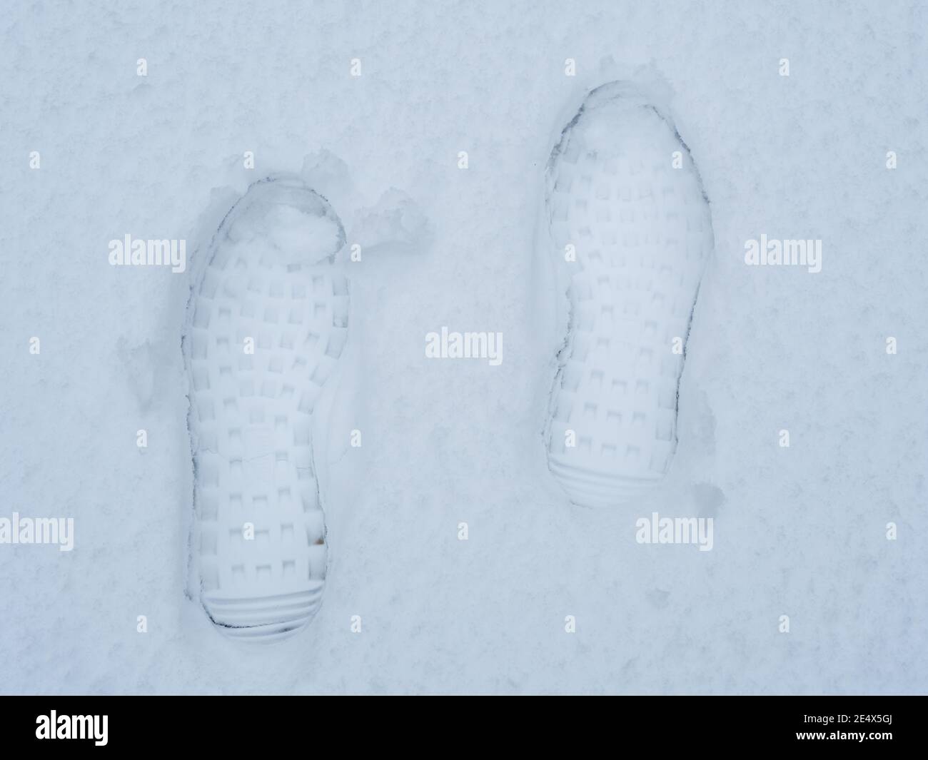 fresh footprints in the snow on a footpath Stock Photo - Alamy
