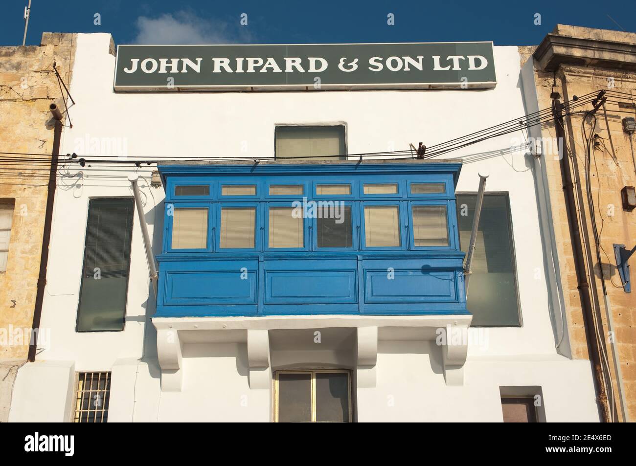 traditional closed balcony (gallarija) on facade of JOHN RIPARD & SON LTD in Valletta, Malta ...