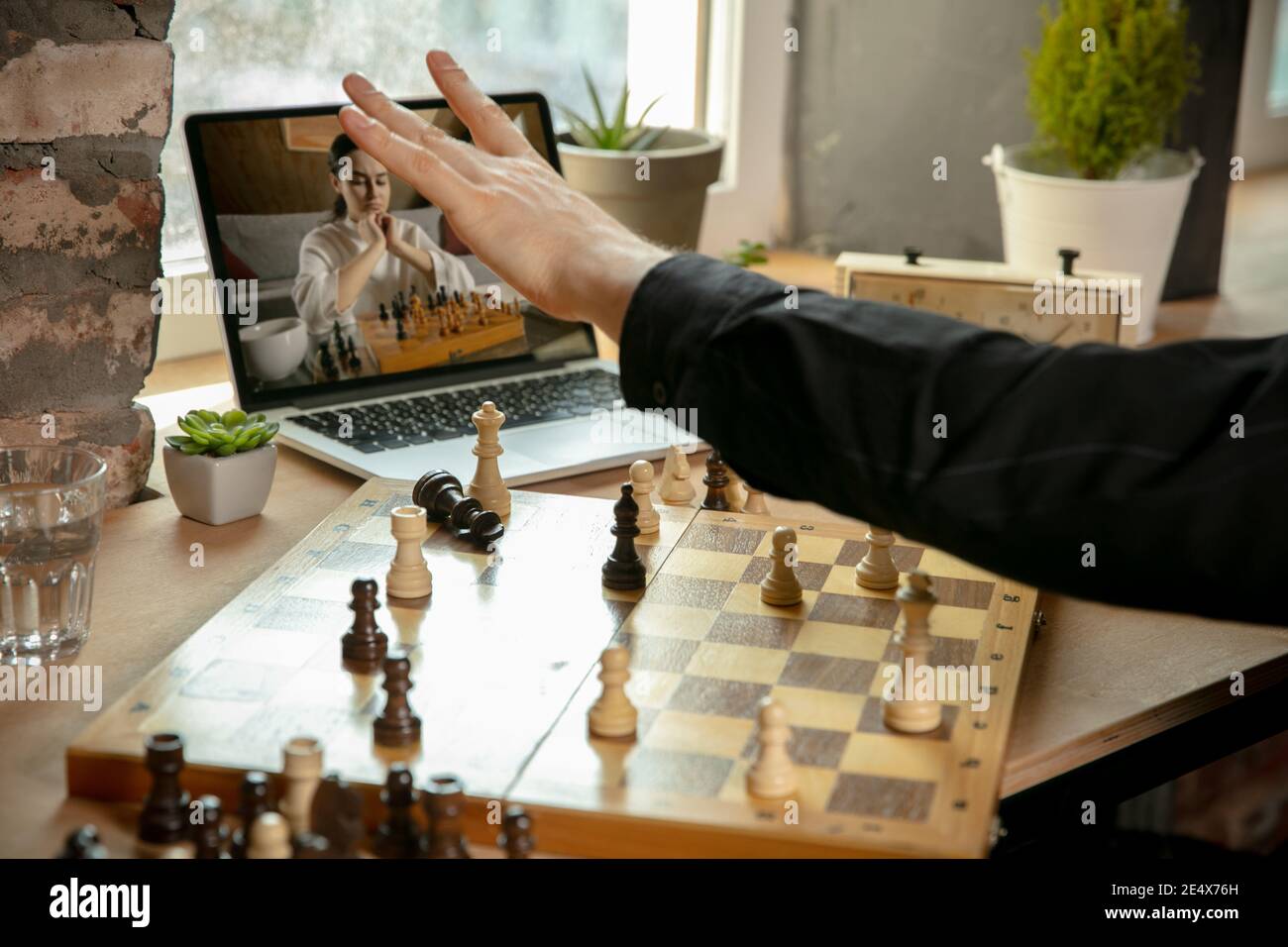 Caucasian man chess player playing chess online with his student Stock ...