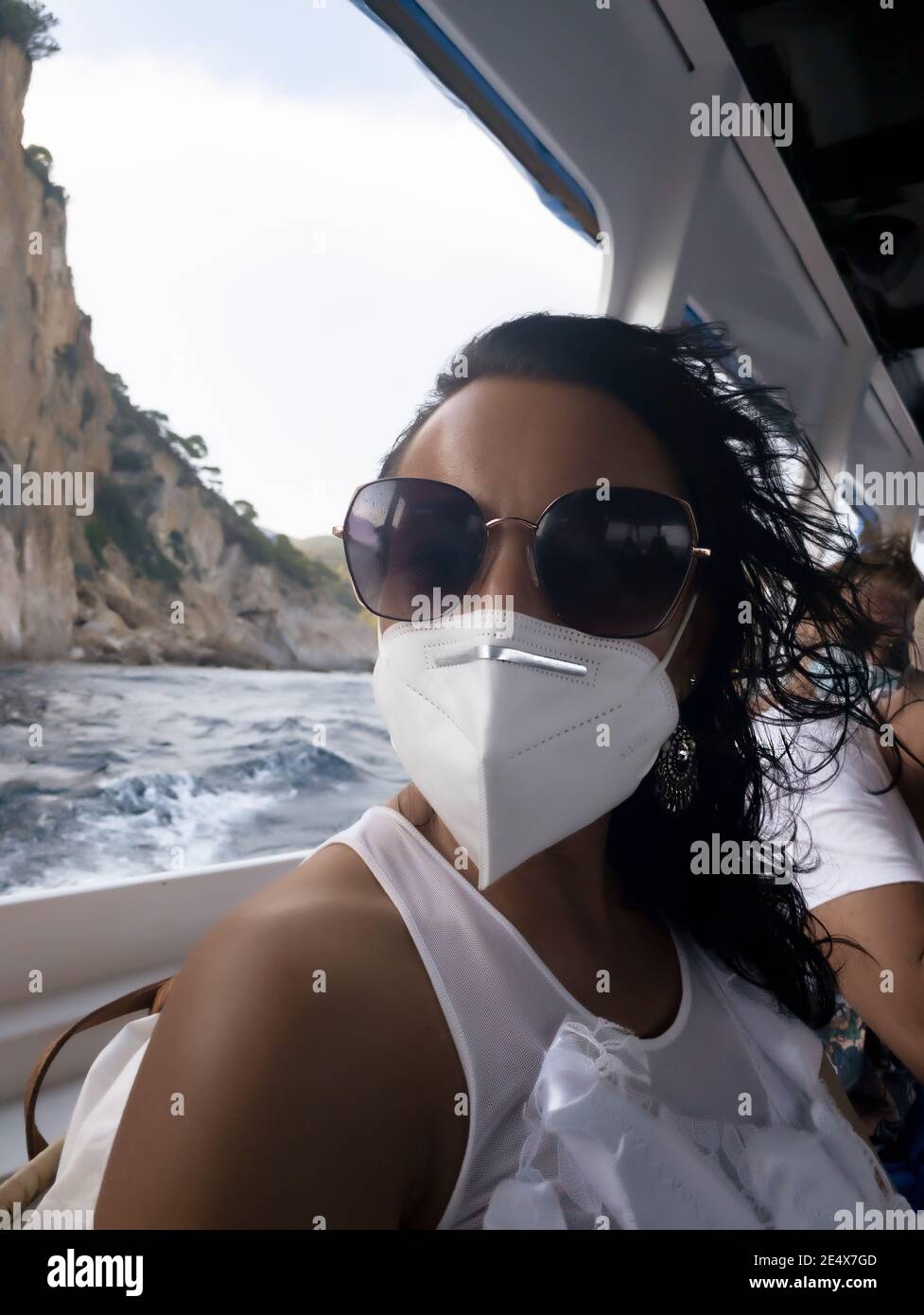 Selective focus - Beautiful woman wearing a face mask in a boat Stock ...