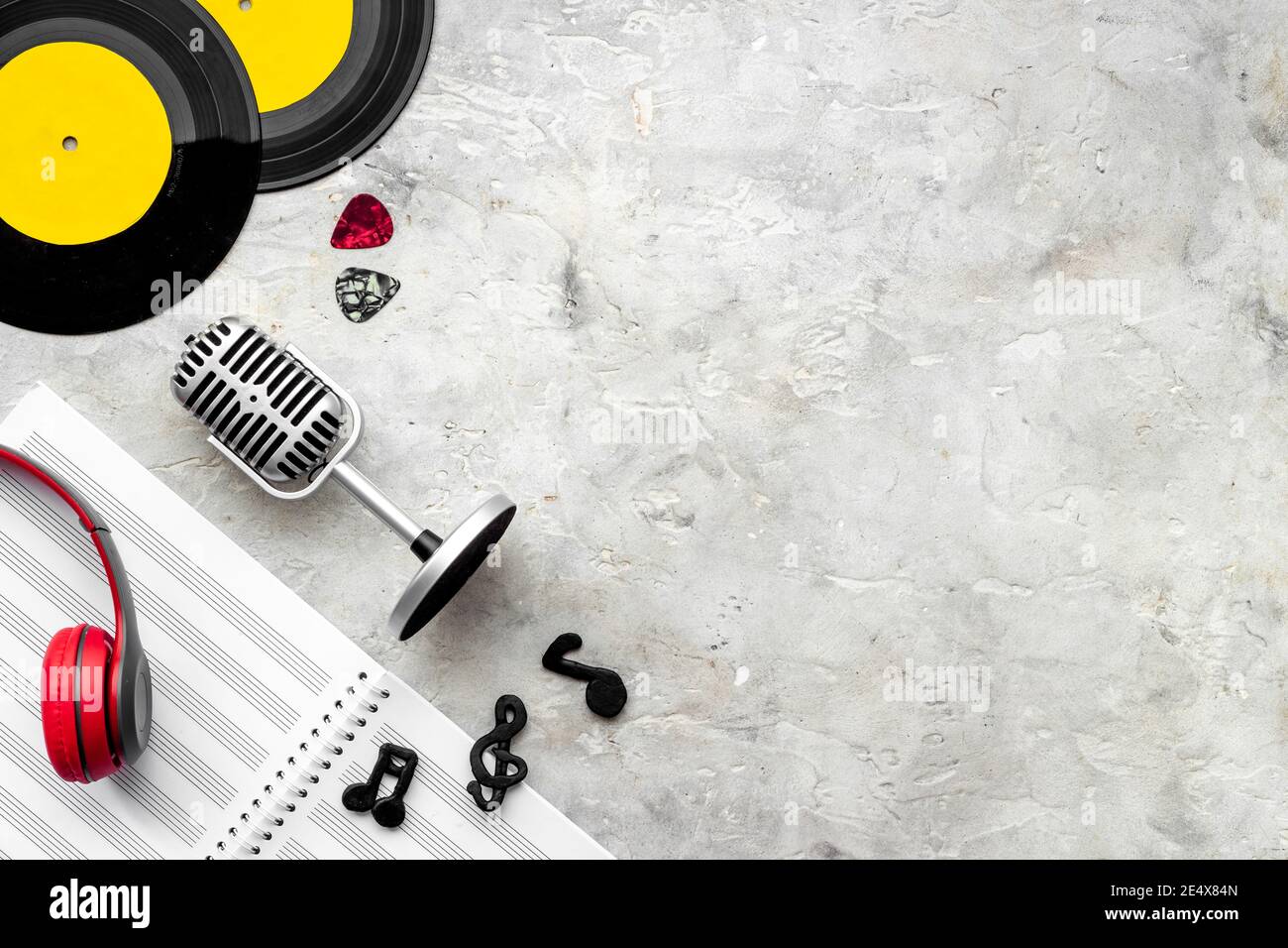 Flat lay of music background - instrument with sheet music, top view ...