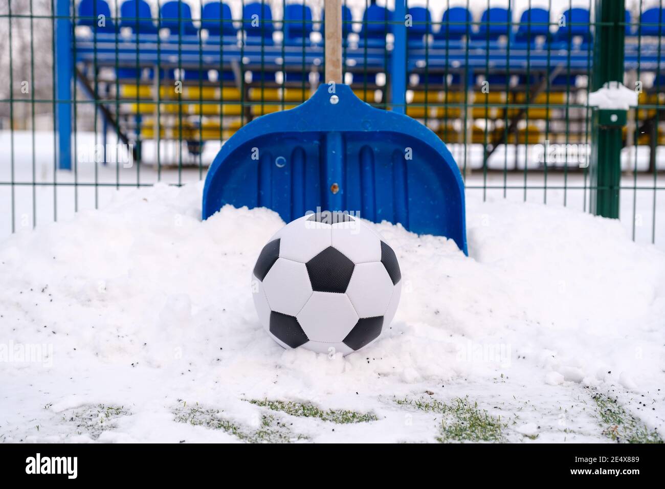 Classic soccer ball, snow-covered football field and shovel Stock Photo ...