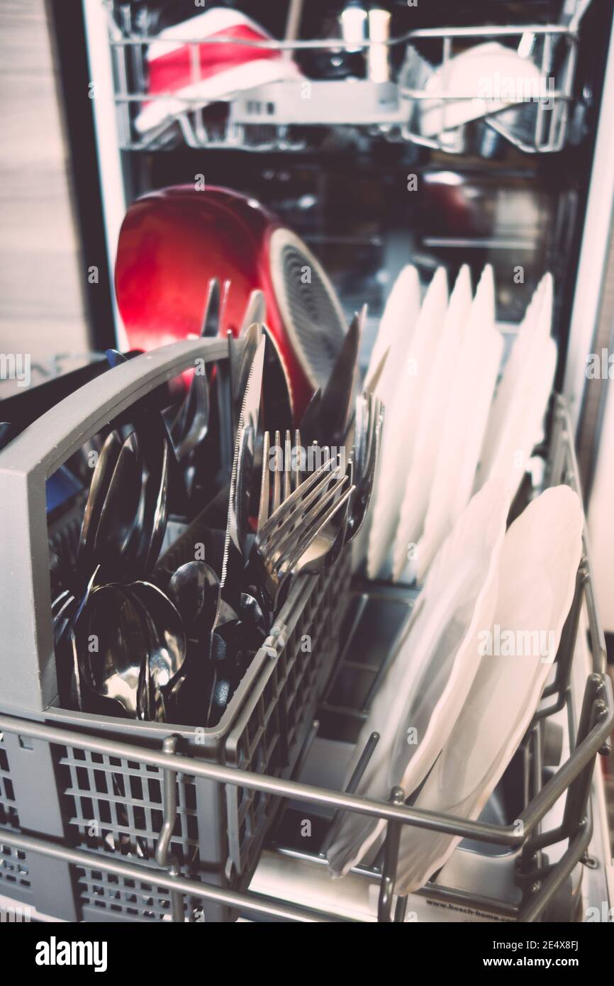 Open dishwasher in a kitchen. Closeup view Stock Photo - Alamy