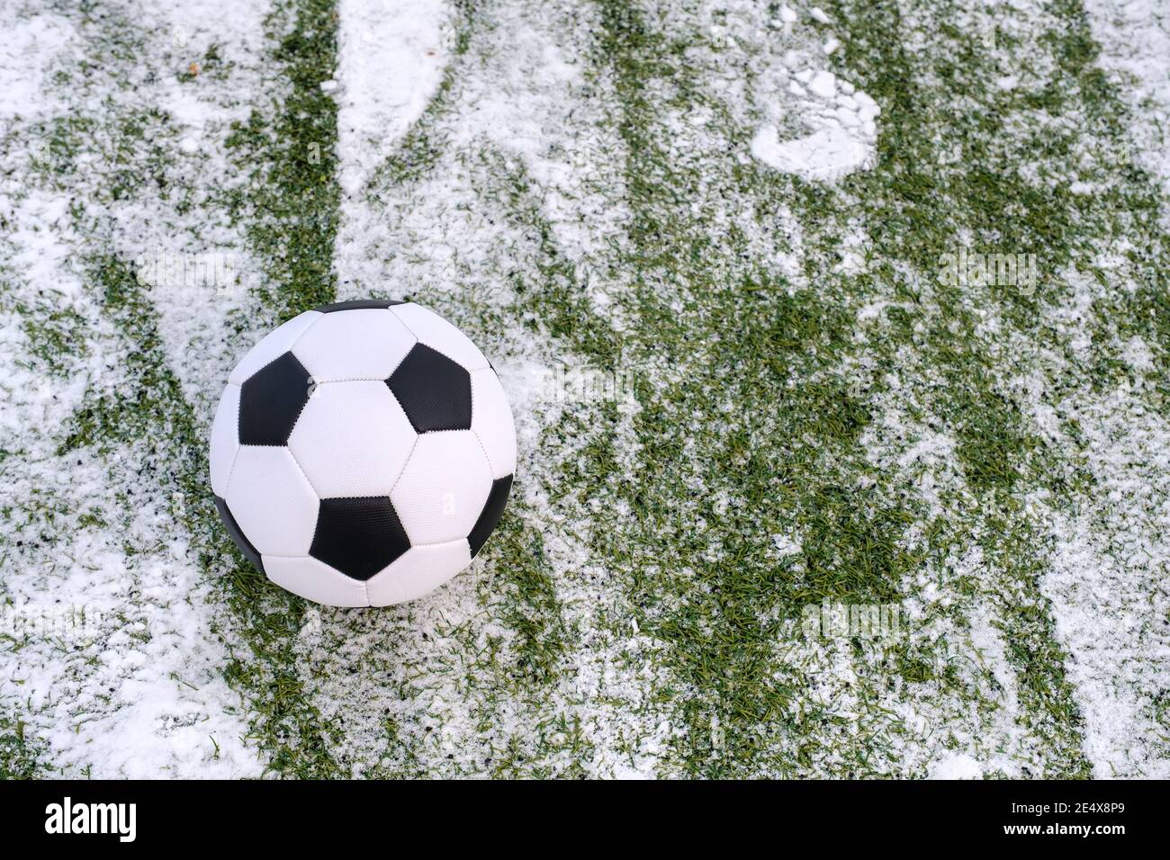 Football ball on snowy grass in winter Stock Photo - Alamy