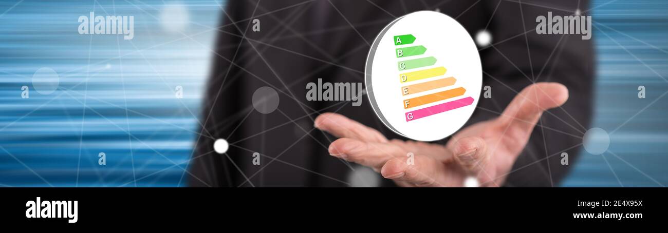 Energy efficiency concept above the hand of a man in background Stock ...