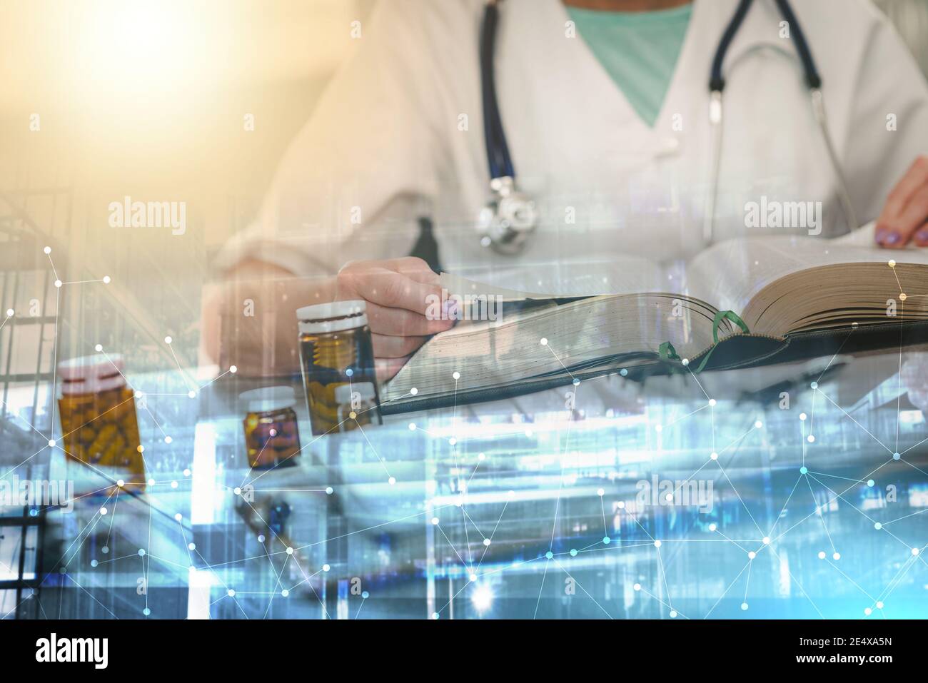 Female doctor reading a textbook in medical office; multiple exposure ...