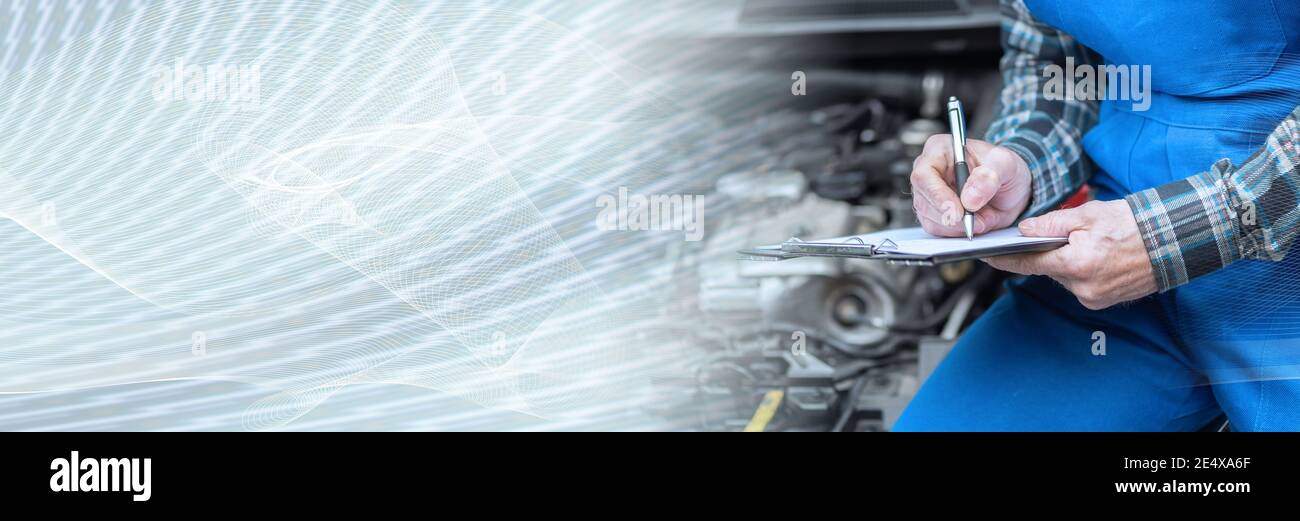 Car mechanic checking a car engine and writing on clipboard; panoramic ...