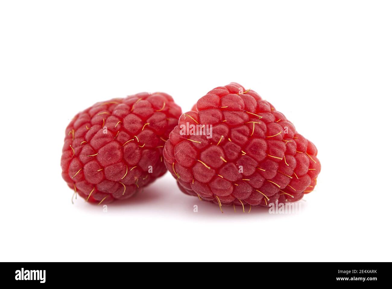Red ripe raspberry fruits isolated on white background Stock Photo - Alamy
