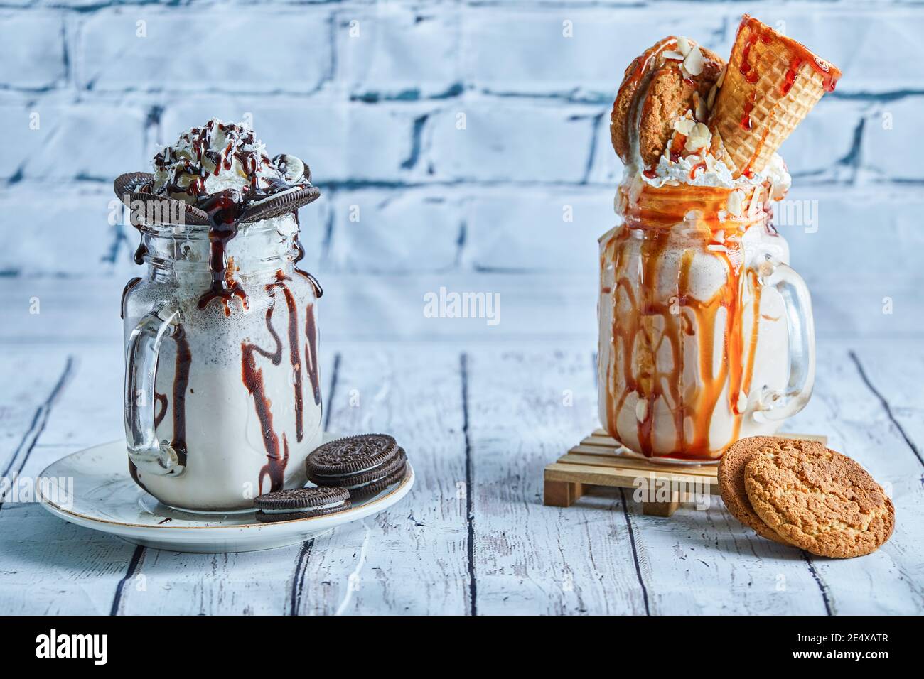 Oreo milkshake with Caramel ring freakshake in the gray background ...