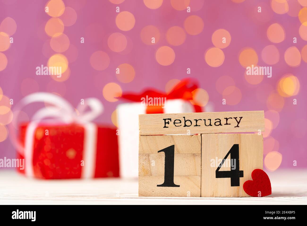 Wooden calendar 14th of February on pink bokeh background Stock Photo ...