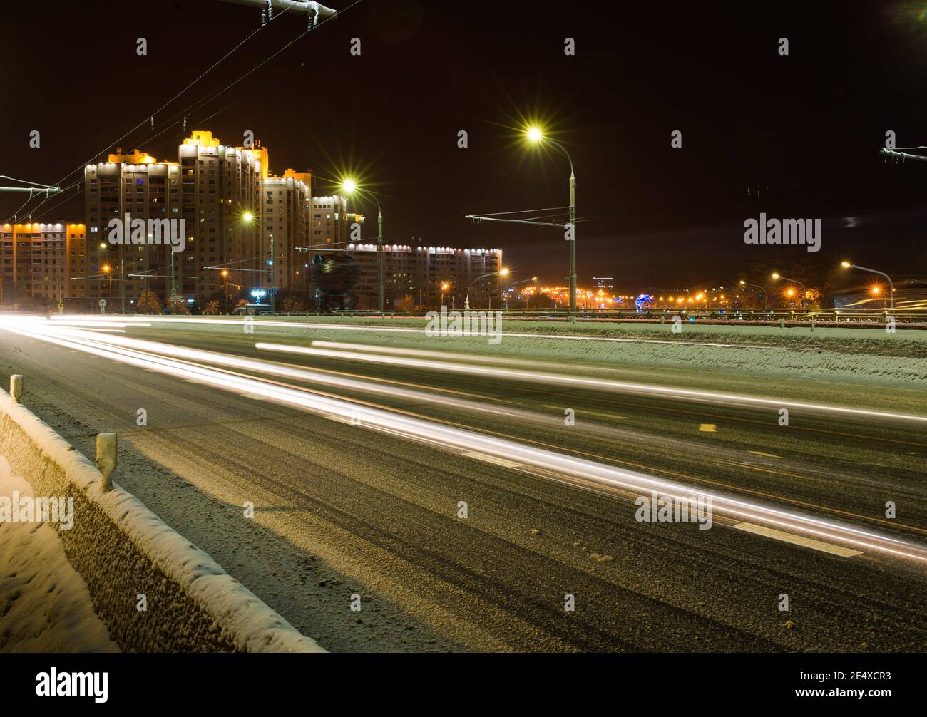 Winter night road in the city, snow background Stock Photo - Alamy