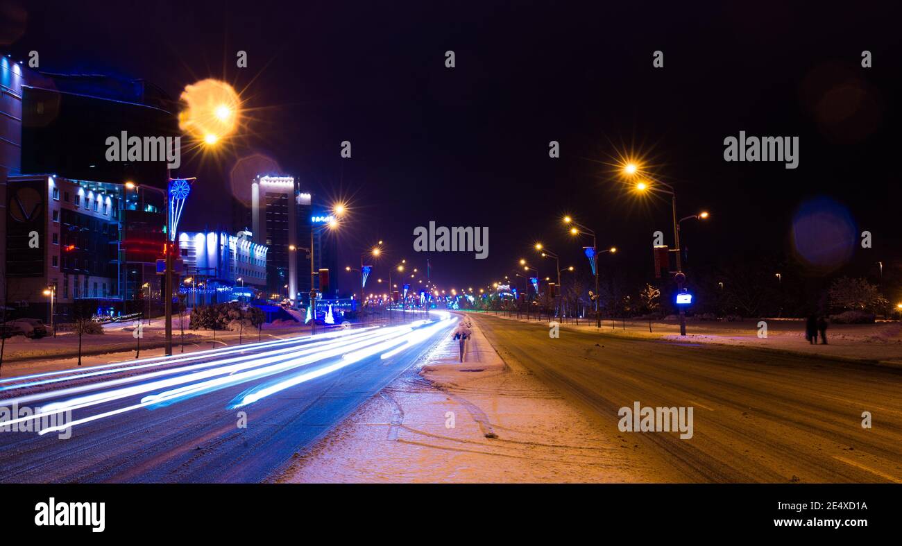 Winter night road in the city, snow background Stock Photo - Alamy