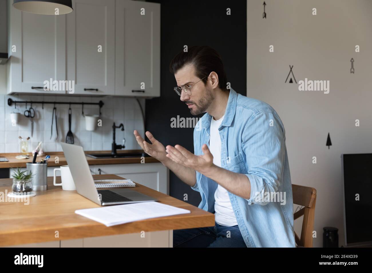 Angry male working from home losing data at pc crash Stock Photo - Alamy