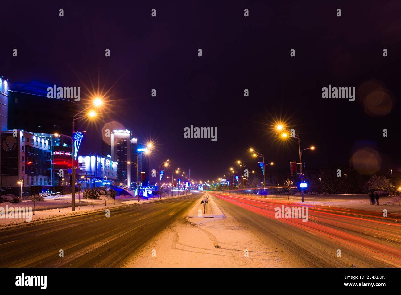 Winter night road in the city, snow background Stock Photo - Alamy
