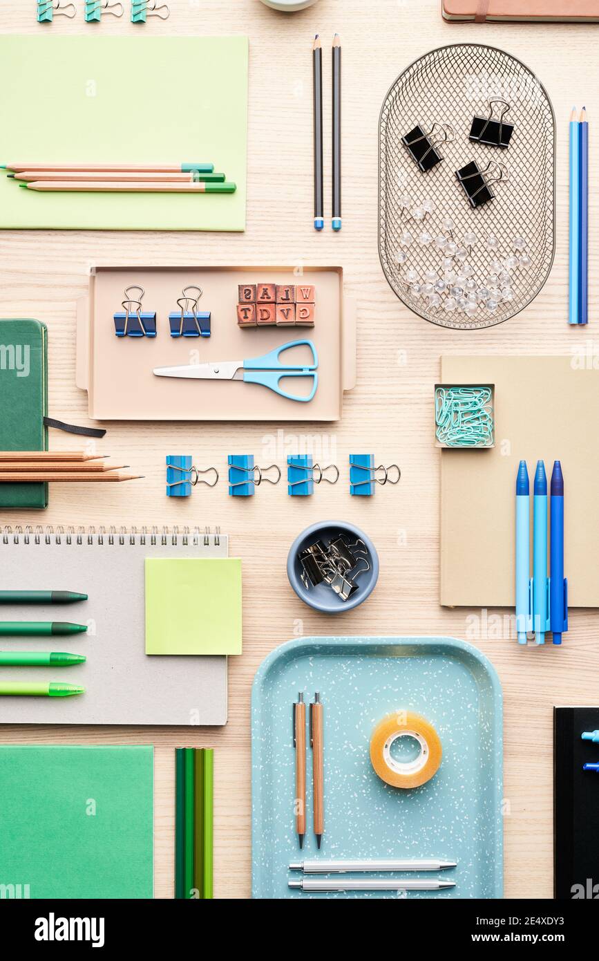 Flat lay of various colorful stationery placed in order on desk in ...