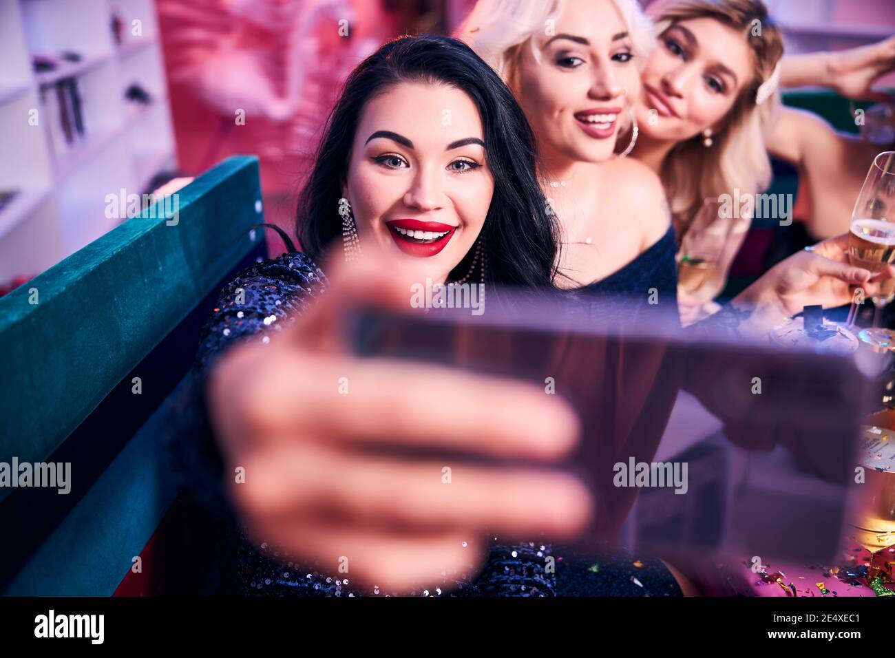 Happy lady and her colleagues posing for a selfie Stock Photo - Alamy