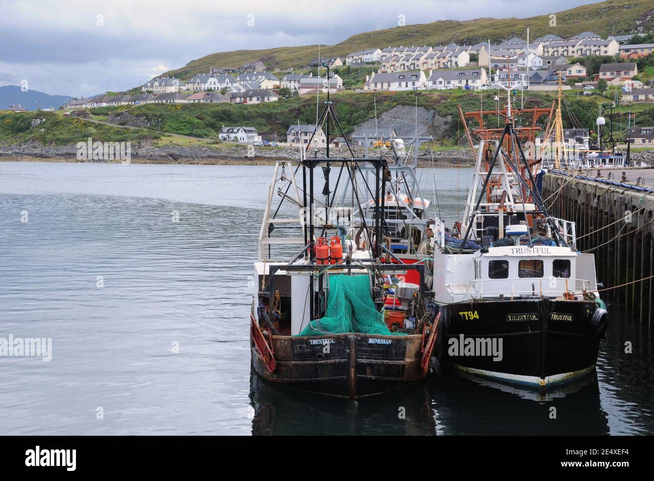 Fishing boats tied up at the port harbour in Mallaig, on the west coast ...