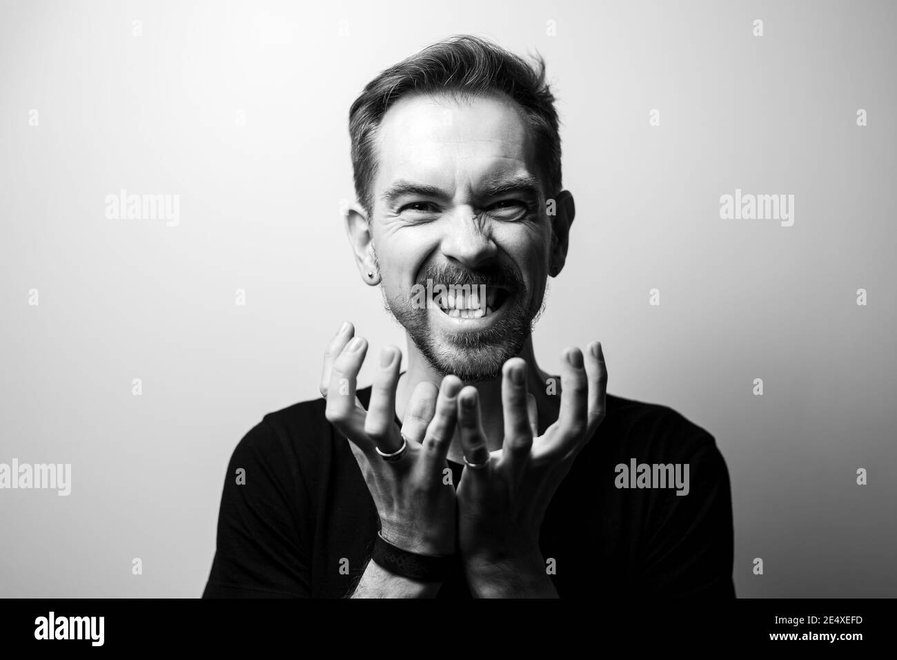 Portrait of a mad man. Black and white Stock Photo - Alamy