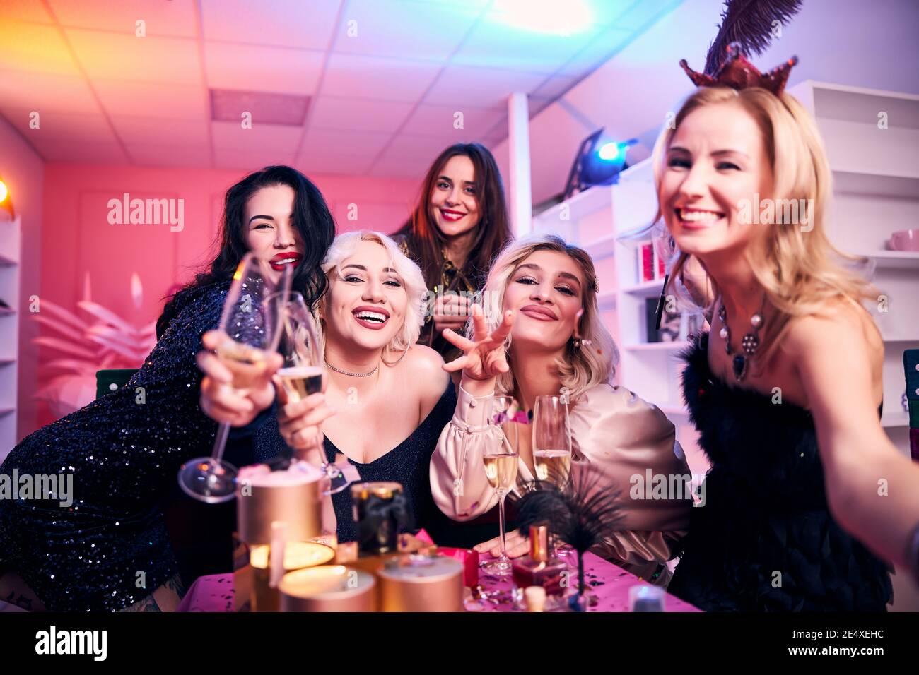 Jolly well-dressed ladies taking selfies in the office Stock Photo - Alamy