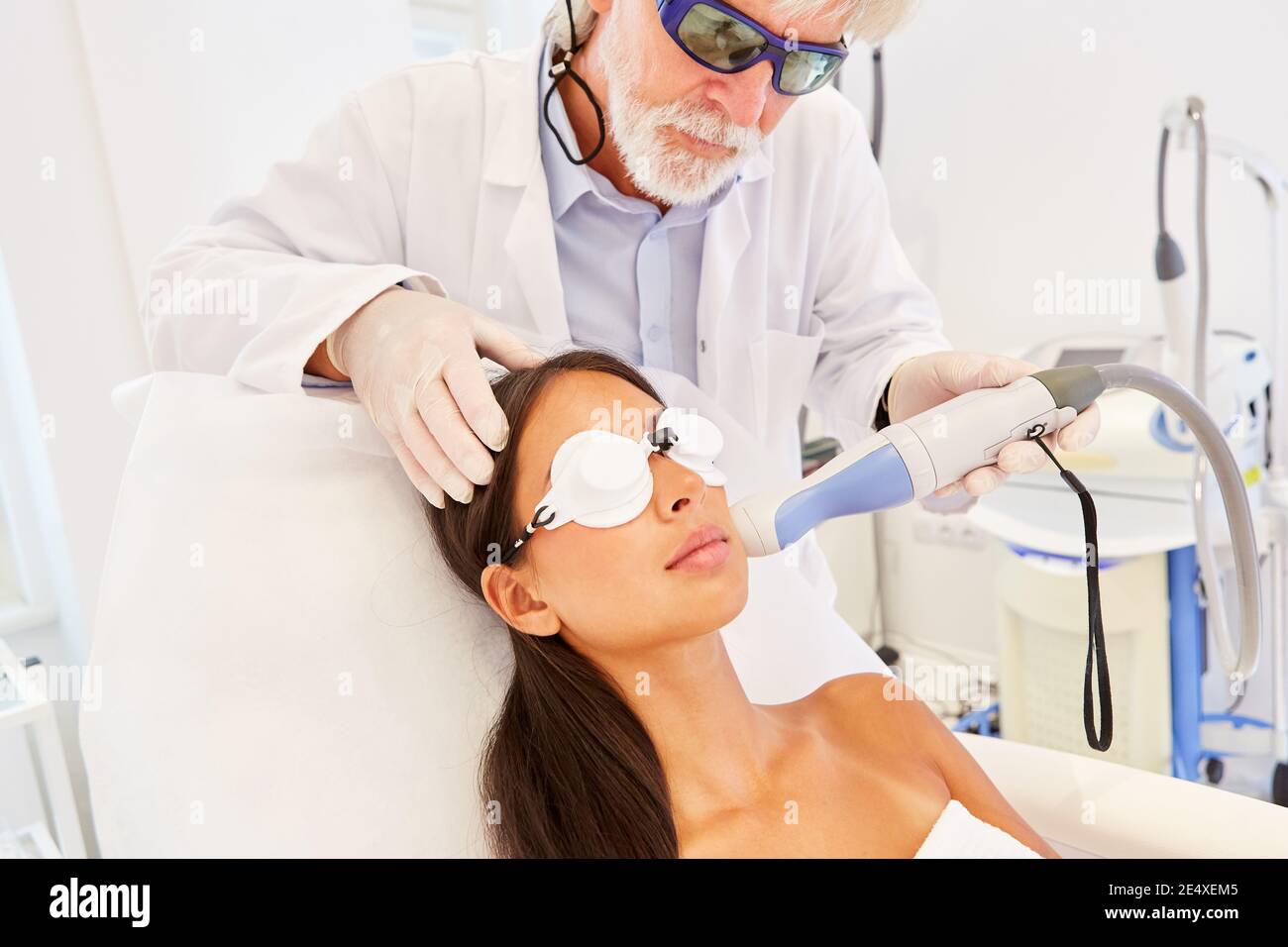 Dermatologist and patient during a laser treatment for acne and skin ...