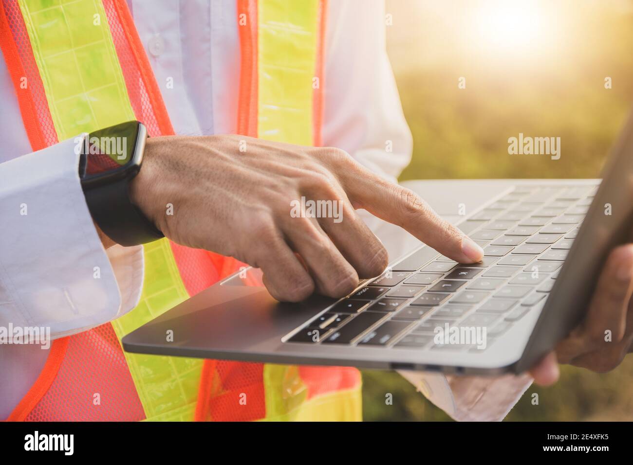 Close up hand touch on laptop keyboard technology Stock Photo - Alamy