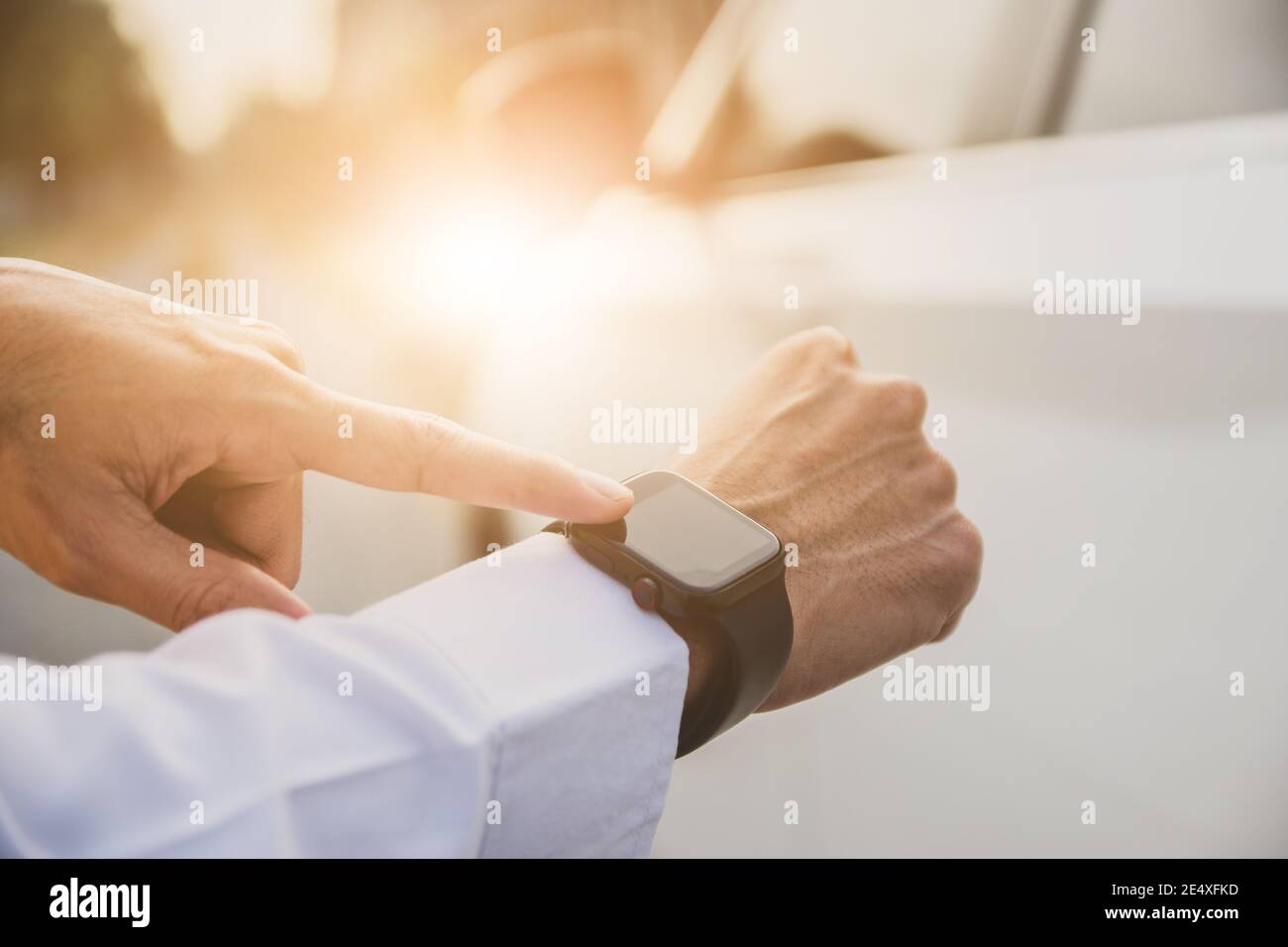 People use technology smartwatch to open and start engine the car Stock ...