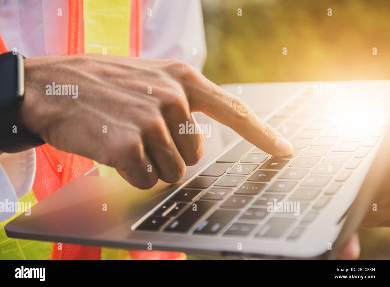 Close up hand touch on laptop keyboard technology Stock Photo - Alamy