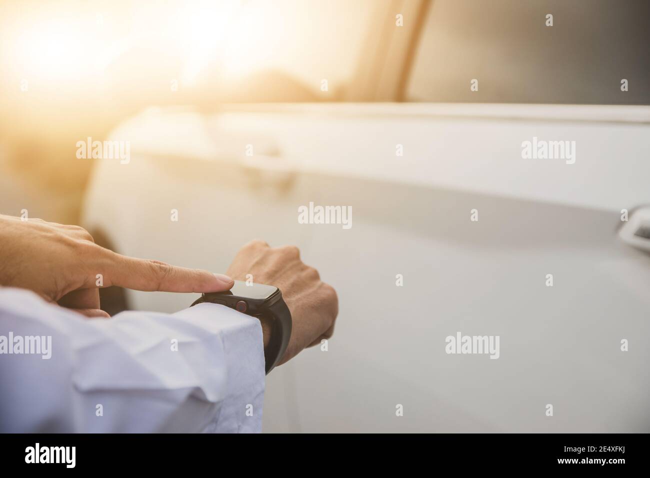 People use technology smartwatch to open and start engine the car Stock ...