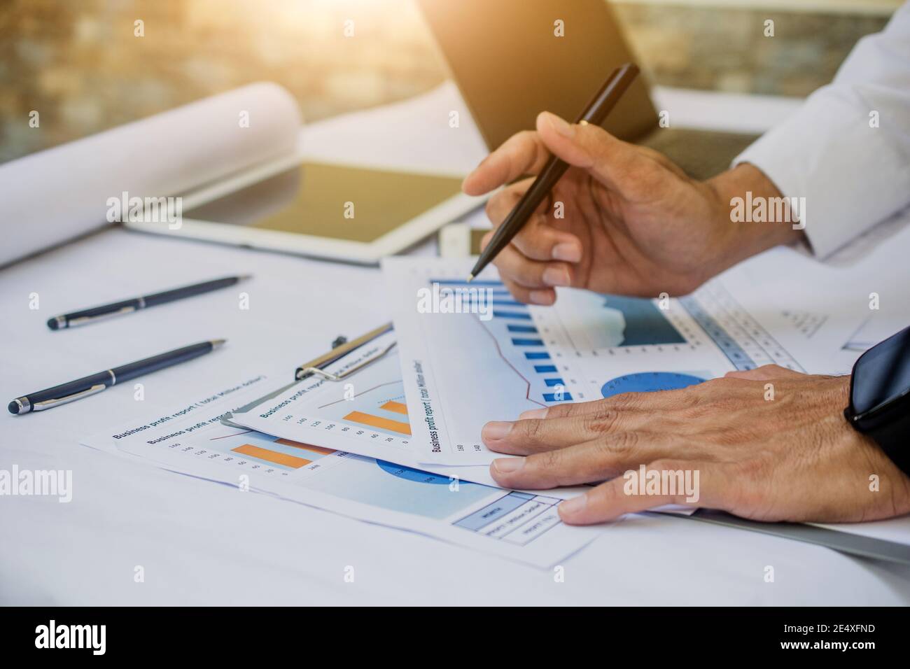 Businessman checking business profit result report in office Stock ...