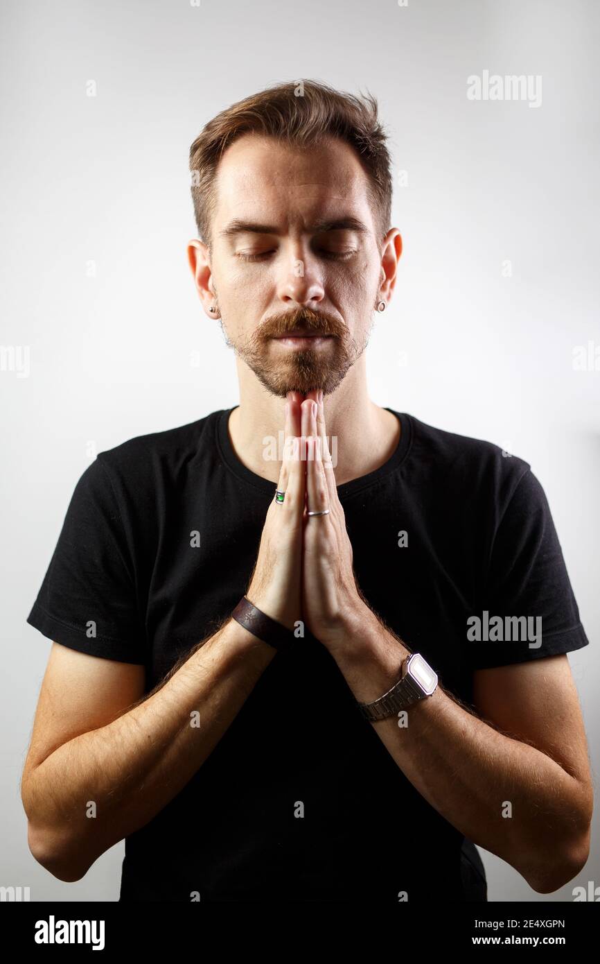 Portrait of a praying man Stock Photo - Alamy