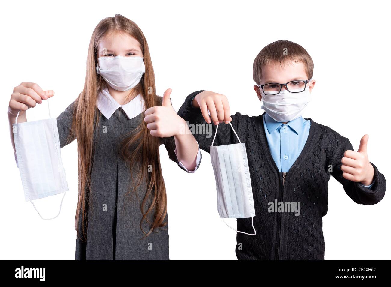A boy and a girl show that masks are good. Isolated on white background ...