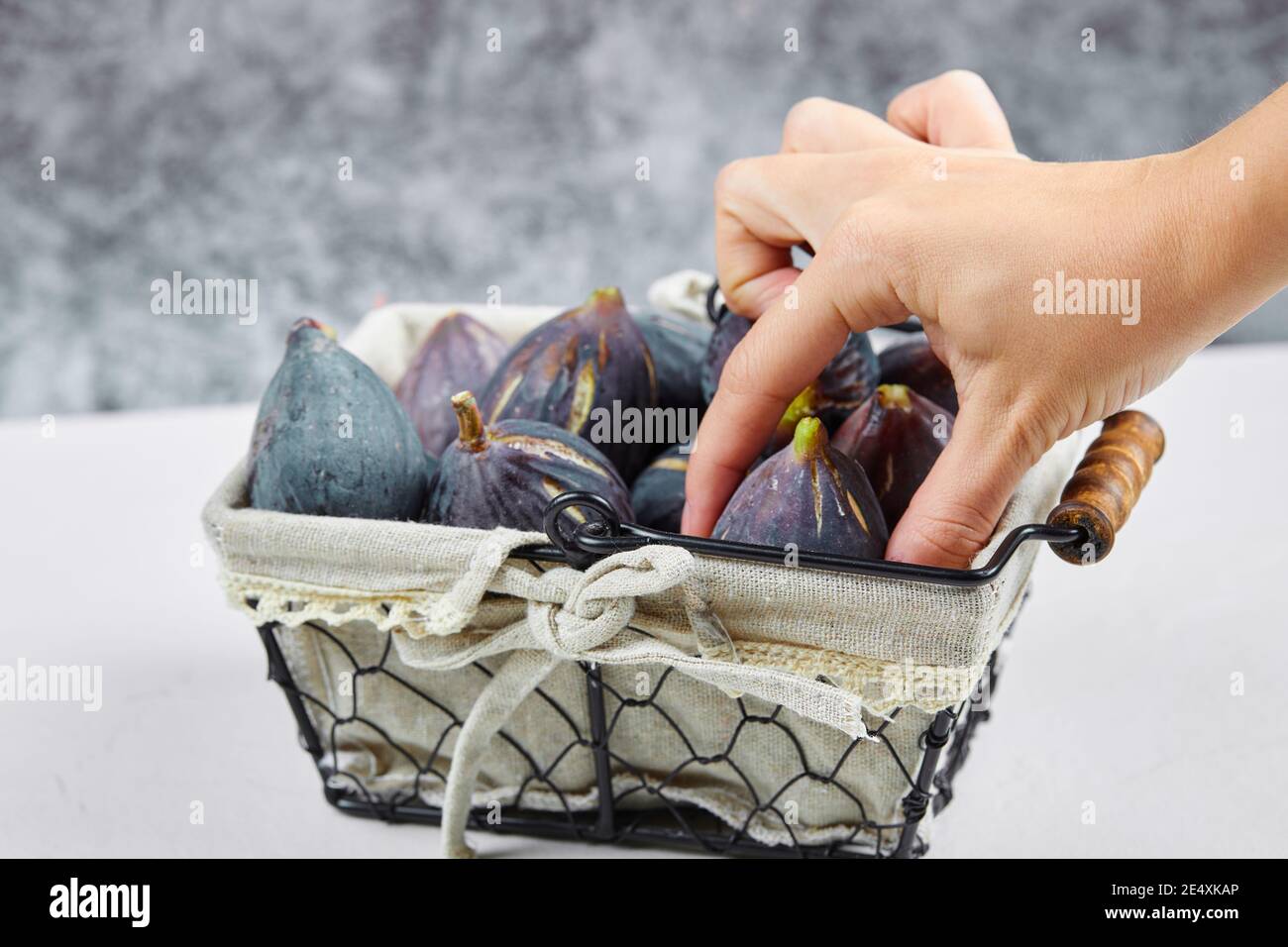 Hand holding fig from hi-res stock photography and images - Alamy
