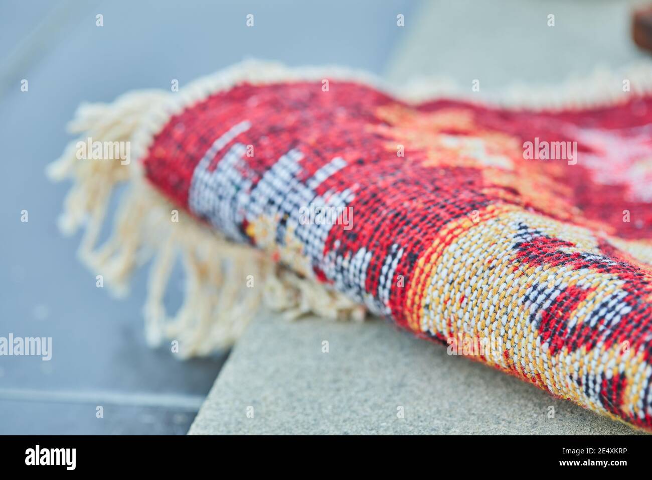 Small carved rug on white background Stock Photo - Alamy